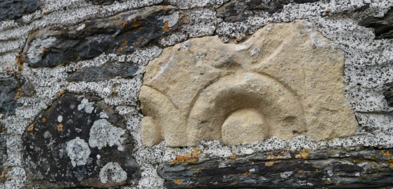 A piece of Dundry Stone in the wall of a farm building at Strata ...